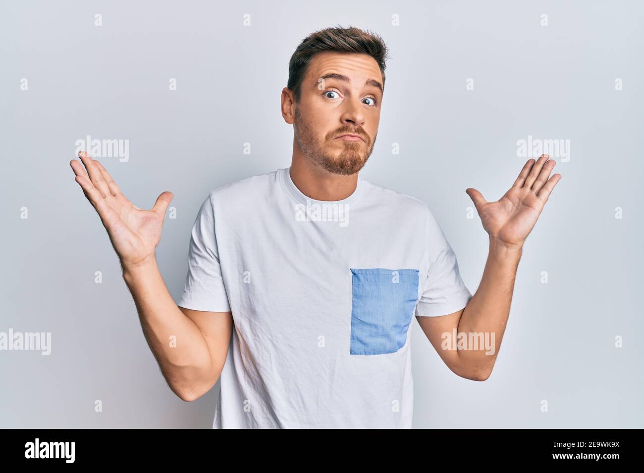 Handsome caucasian man wearing casual clothes clueless and confused ...