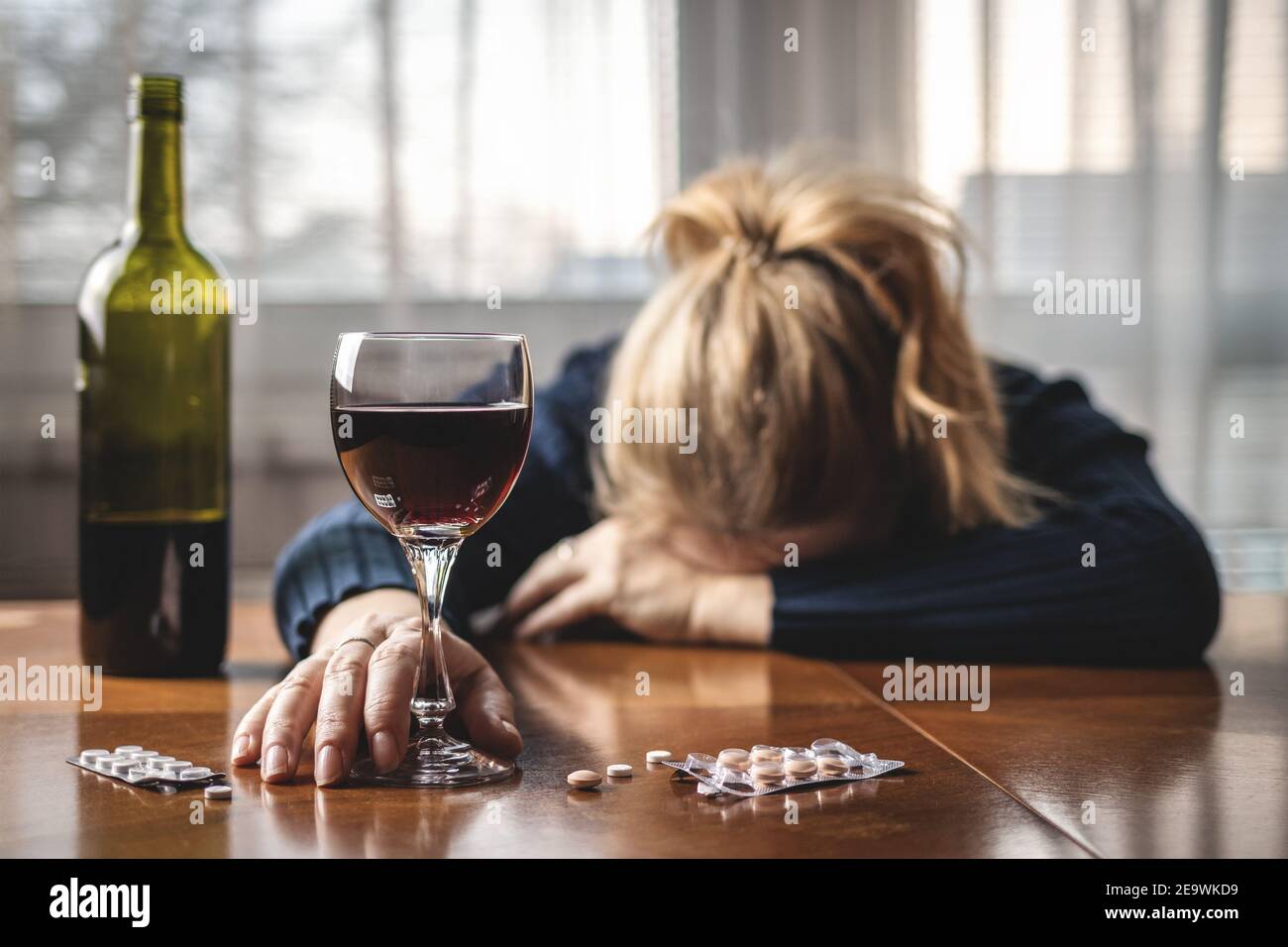 Woman after drug overdose and drinking red wine. Drugs and alcohol ...