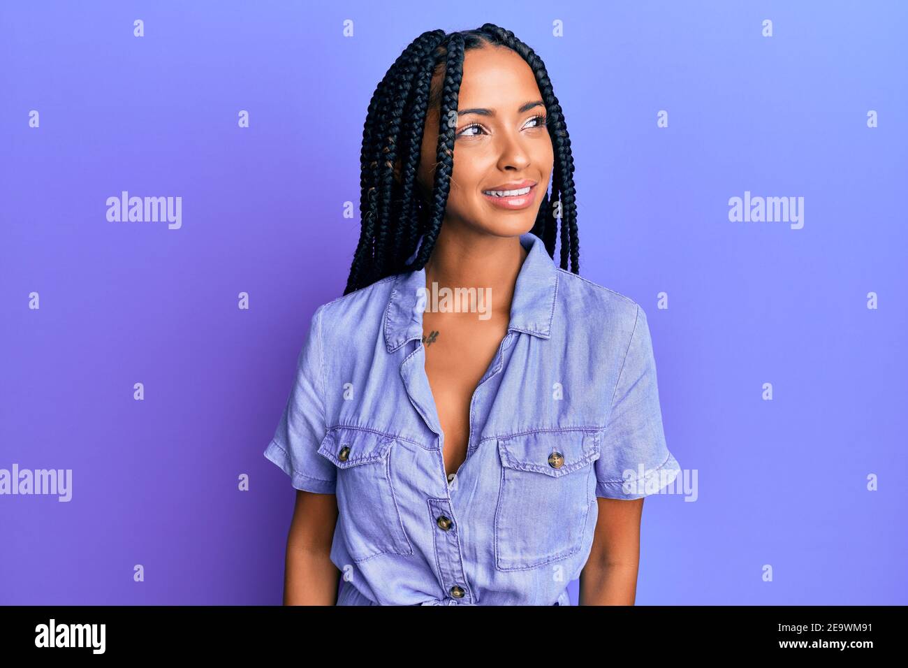 Beautiful hispanic woman wearing casual clothes looking to side, relax ...
