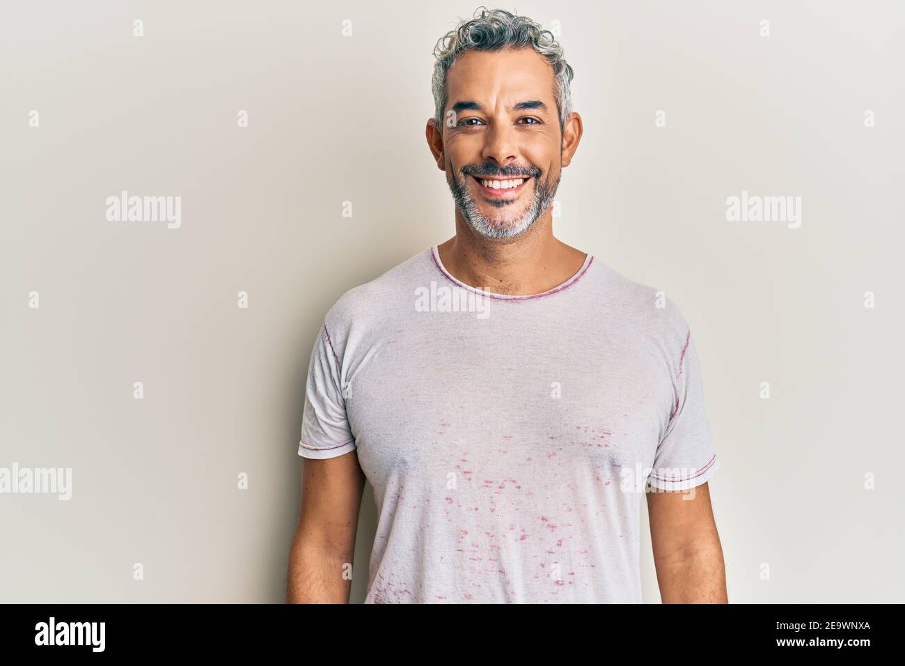 Middle age grey-haired man wearing casual clothes with a happy and cool ...