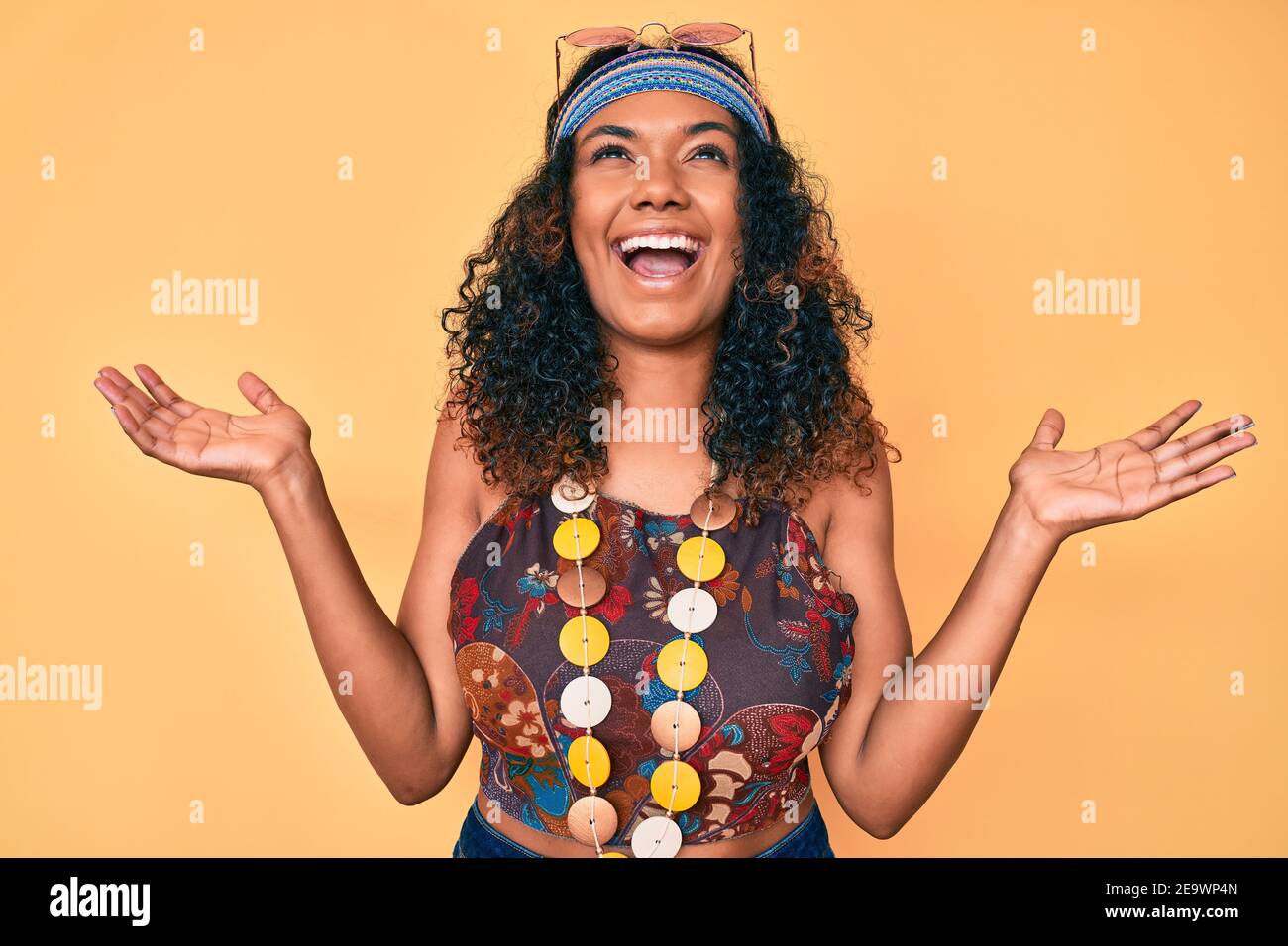Young african american woman wearing bohemian and hippie style ...