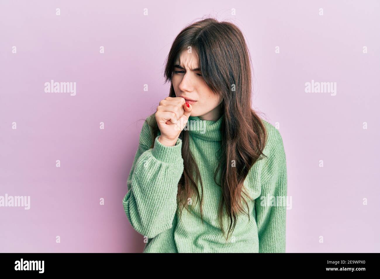 Young beautiful caucasian girl wearing wool sweater feeling unwell and ...
