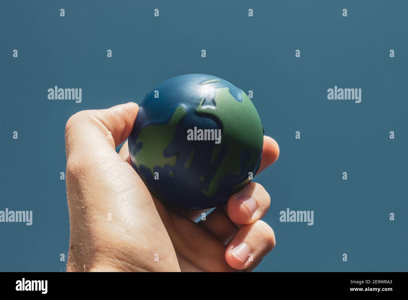 Earth Day. Male hand holding earth in his hands. Human saving planet ...