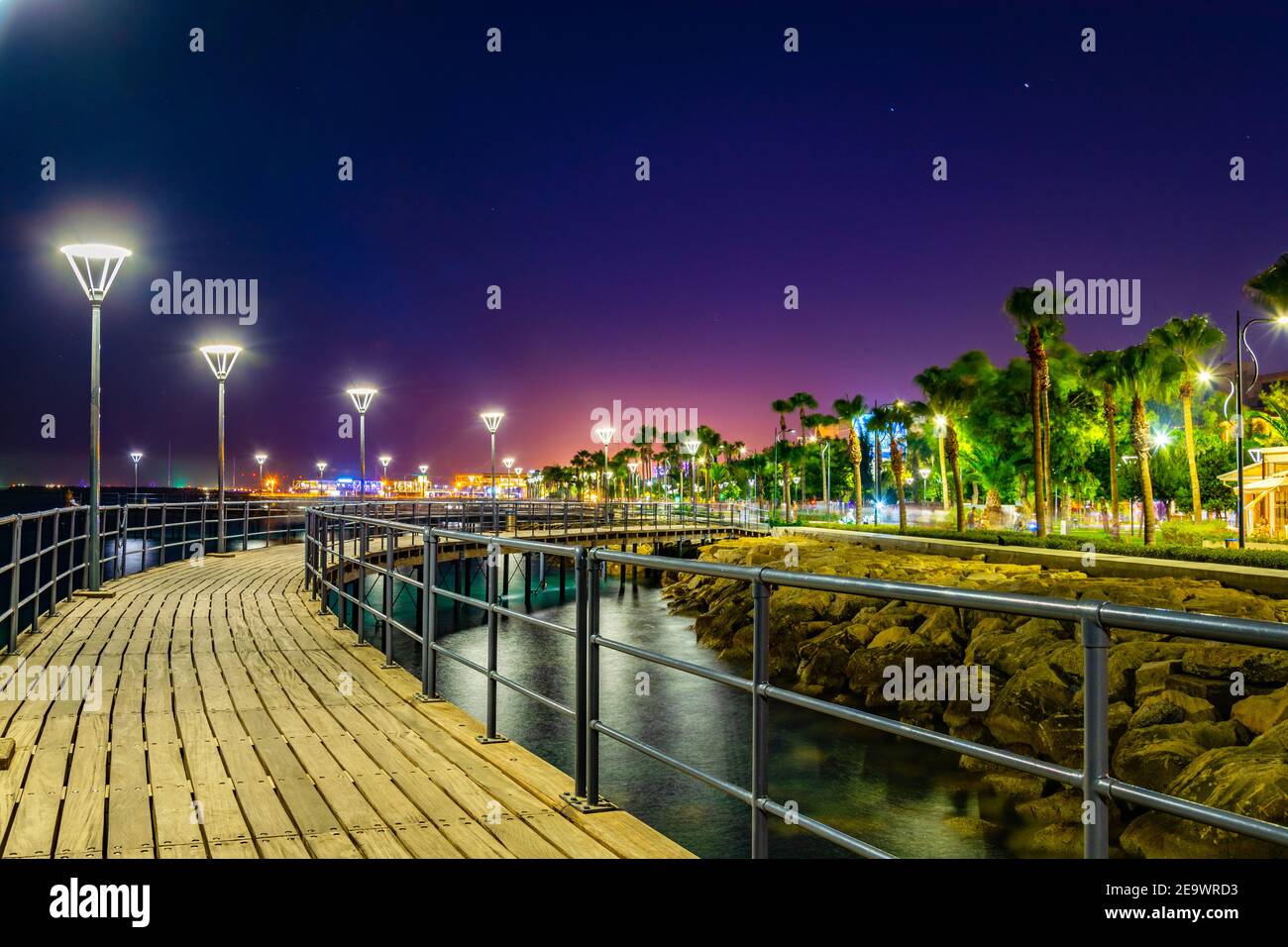 Night view of Molos promenade with several piers leading to the ...