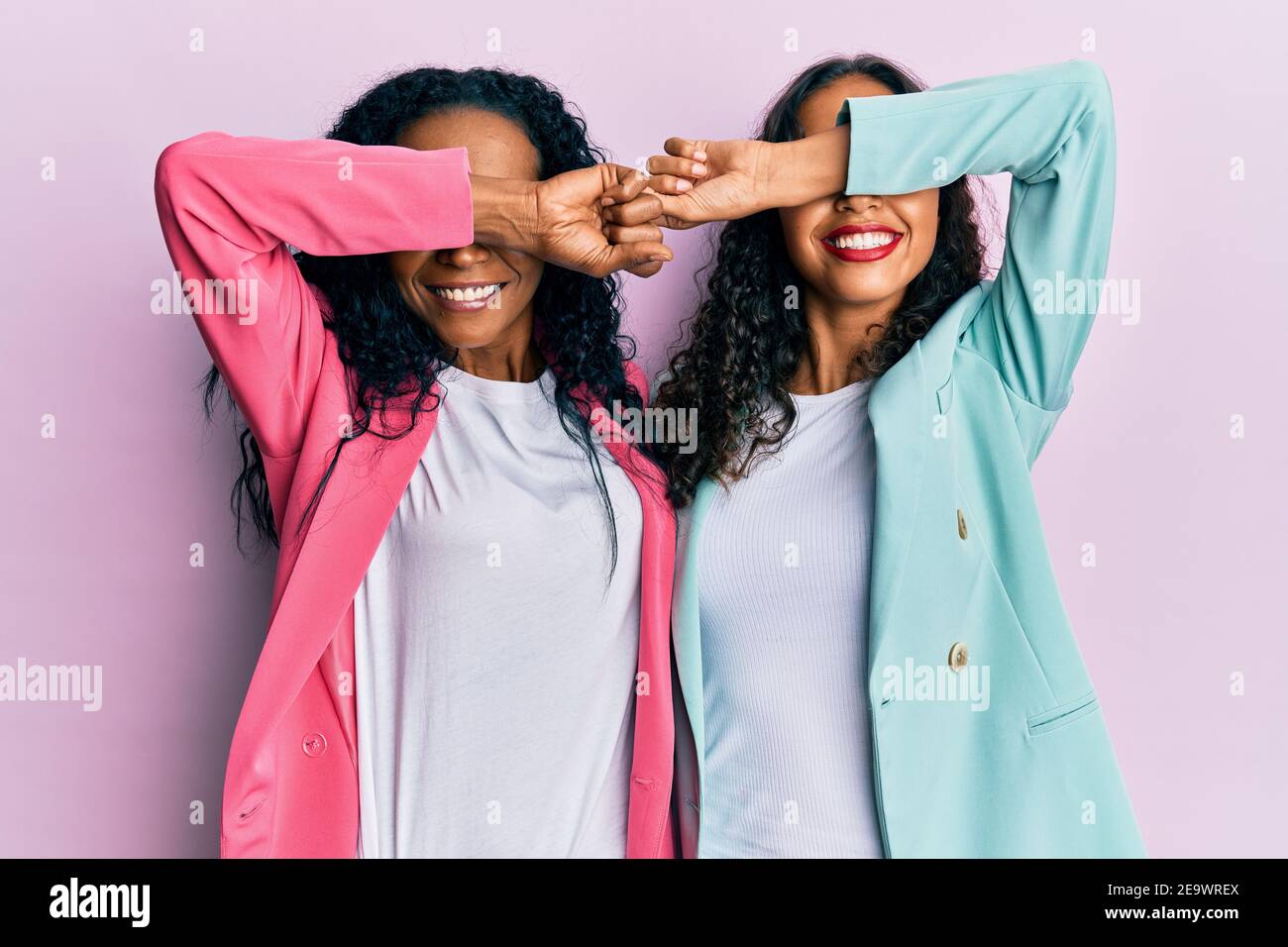 African american mother and daughter wearing business style smiling ...