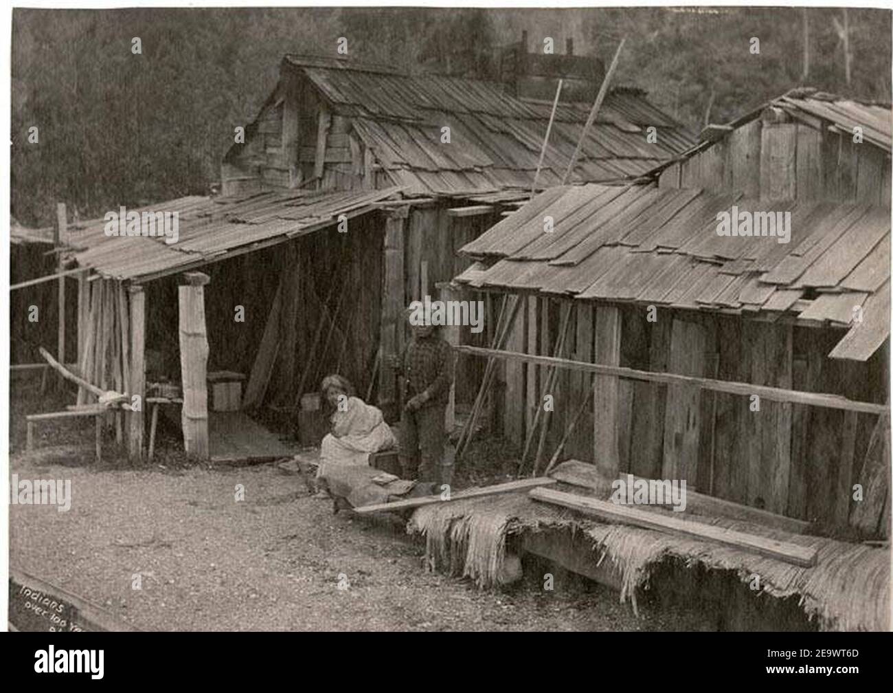 Native American couple posing outside of wooden shack, Seattle, circa 1900 (MOHAI 11195 Stock ...