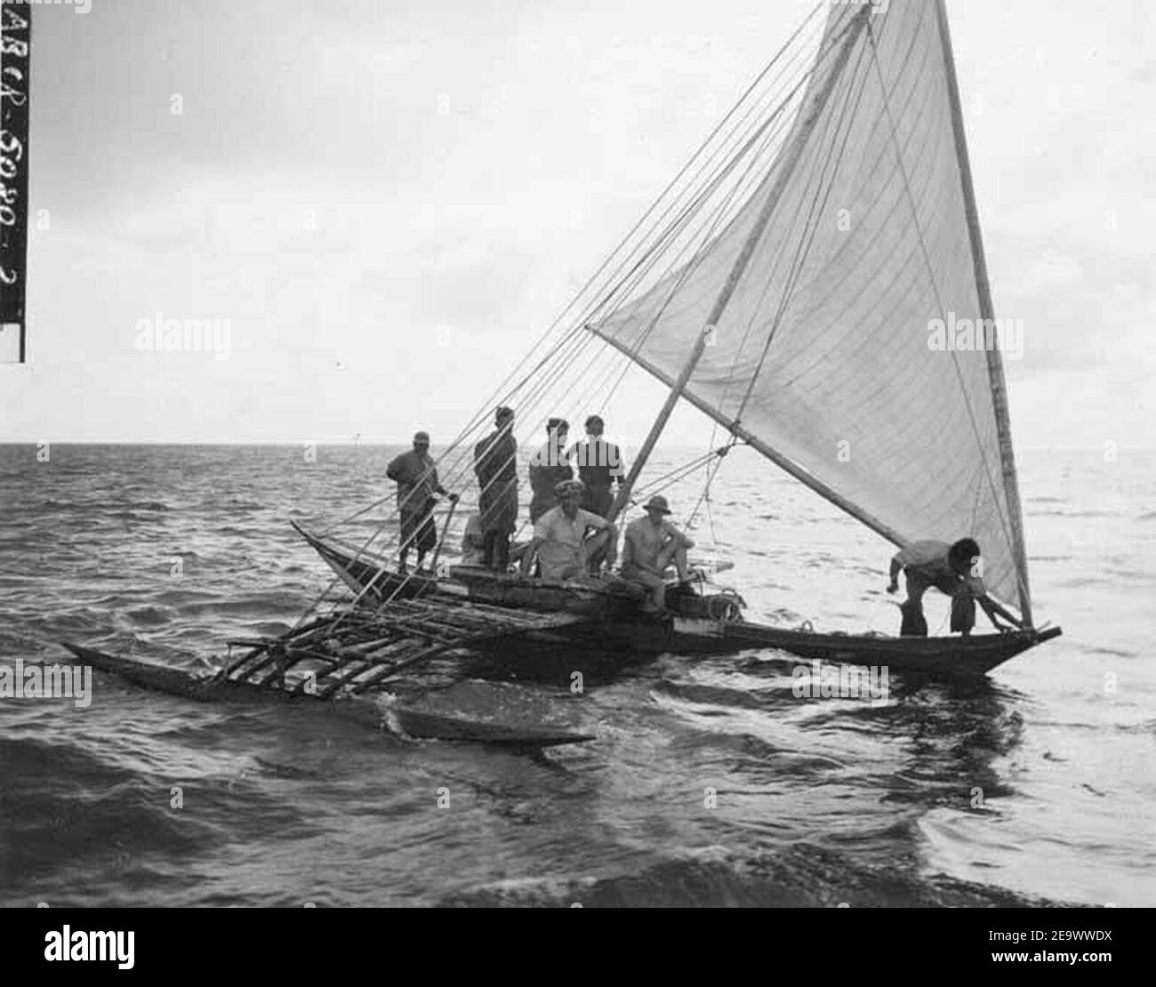 Natives and members of resurvey party in a canoe, Rongerik Island ...
