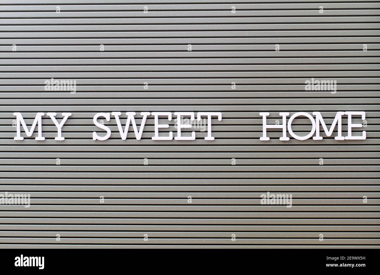 My sweet home, text written with white plastic letters on metal board ...
