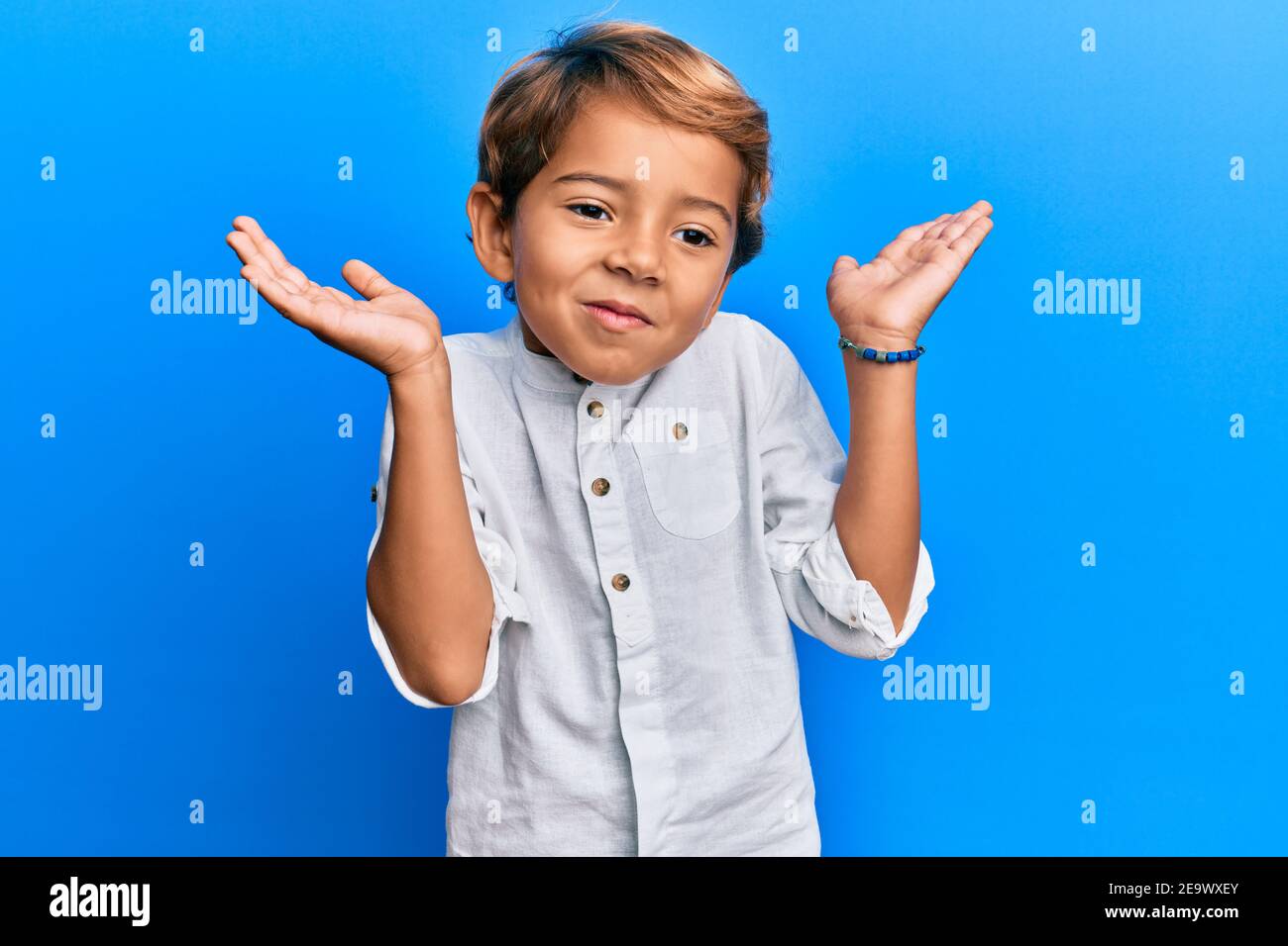 Adorable latin kid wearing casual clothes clueless and confused with ...