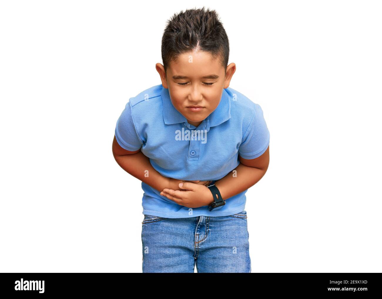 Little boy hispanic kid wearing casual clothes with hand on stomach ...