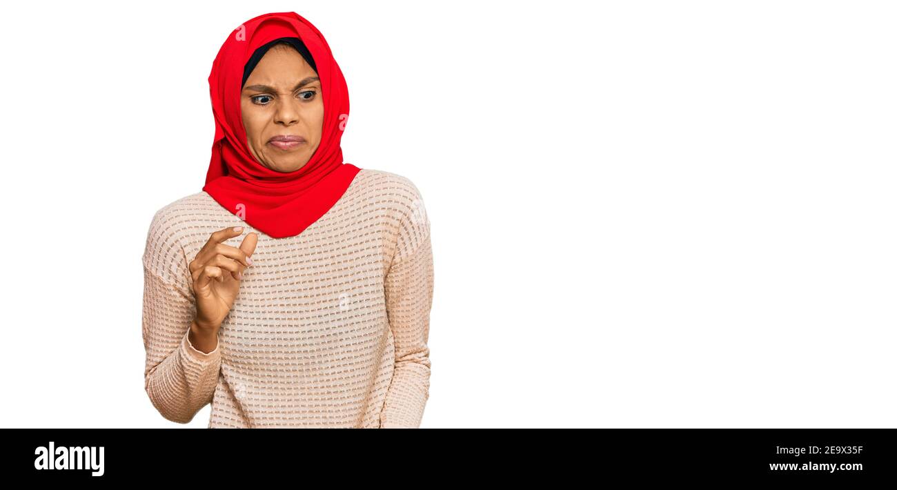 Young african american woman wearing traditional islamic hijab scarf ...