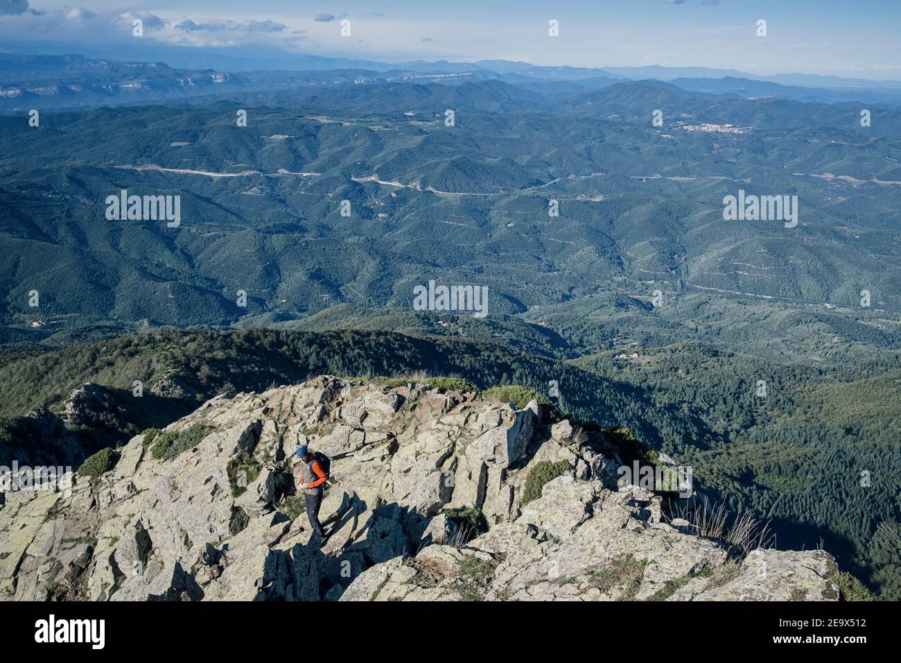 Mountaineer ascending the Castellets ridge to Les Agudes. Montseny ...