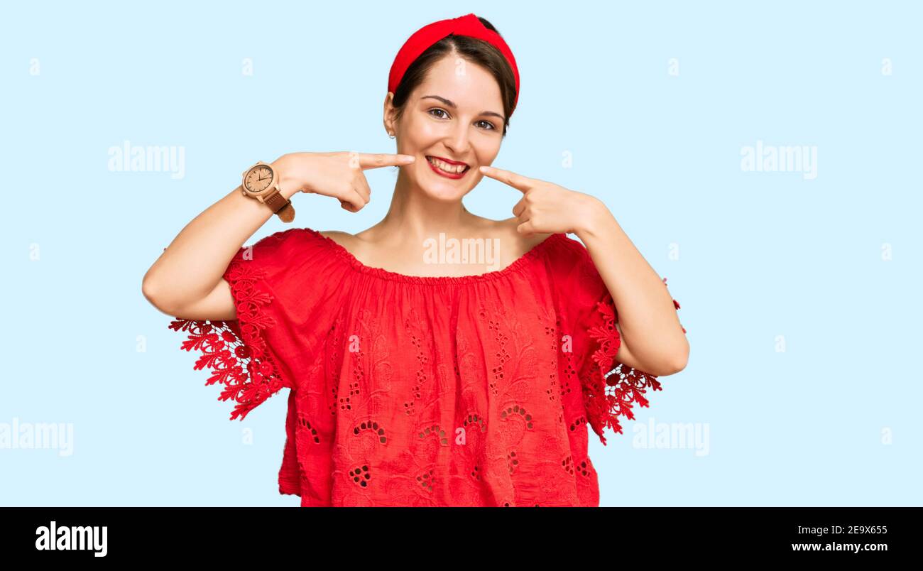 Young brunette woman with short hair wearing casual summer clothes and ...