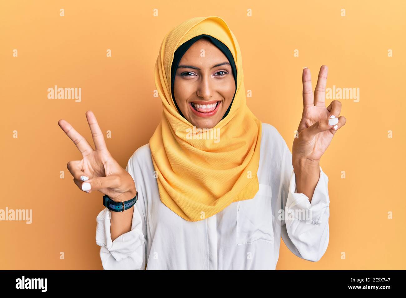 Young brunette arab woman wearing traditional islamic hijab scarf ...
