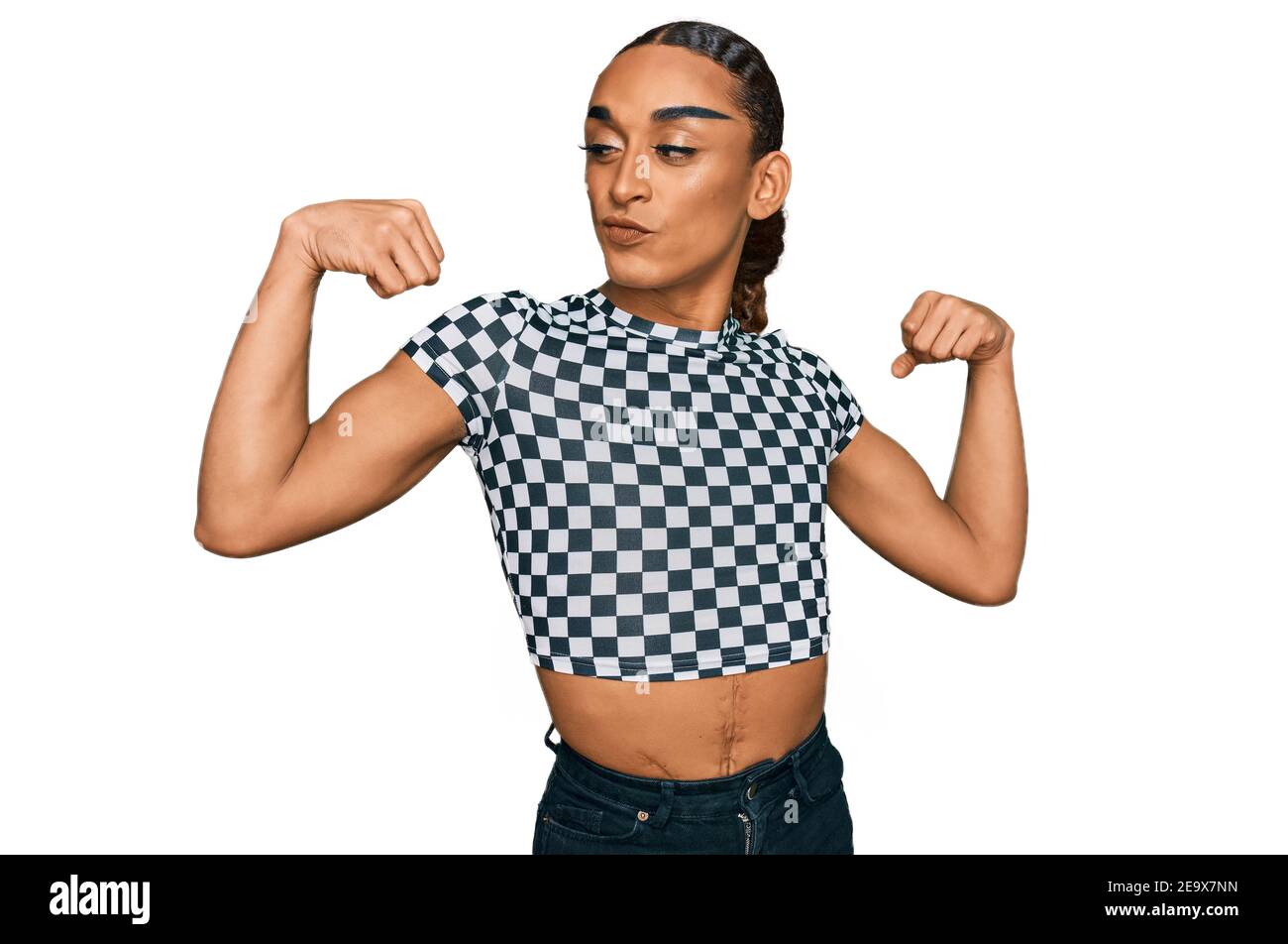 Hispanic transgender man wearing make up and long hair wearing modern ...