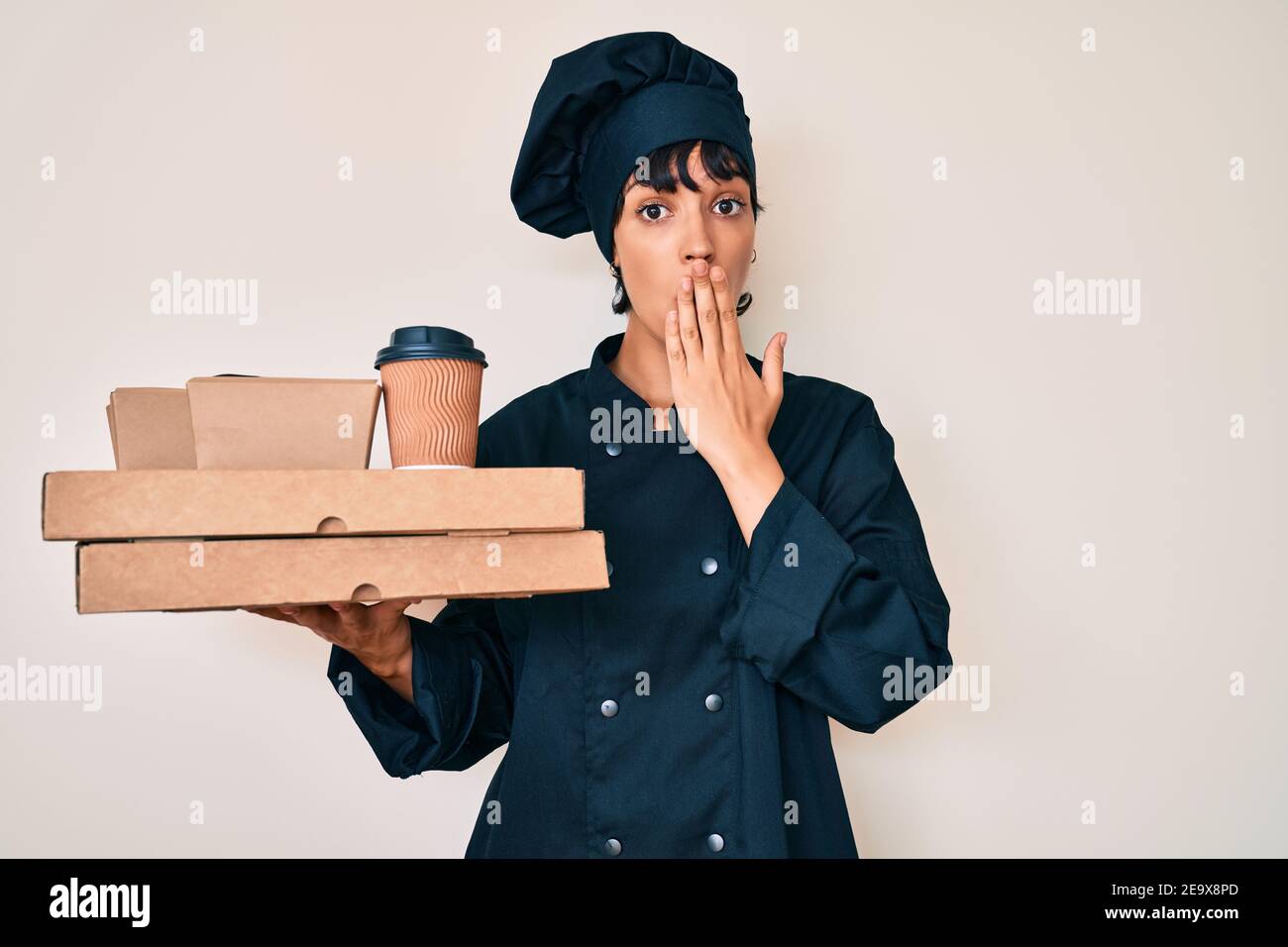 Beautiful brunettte woman professional chef holding take away food ...