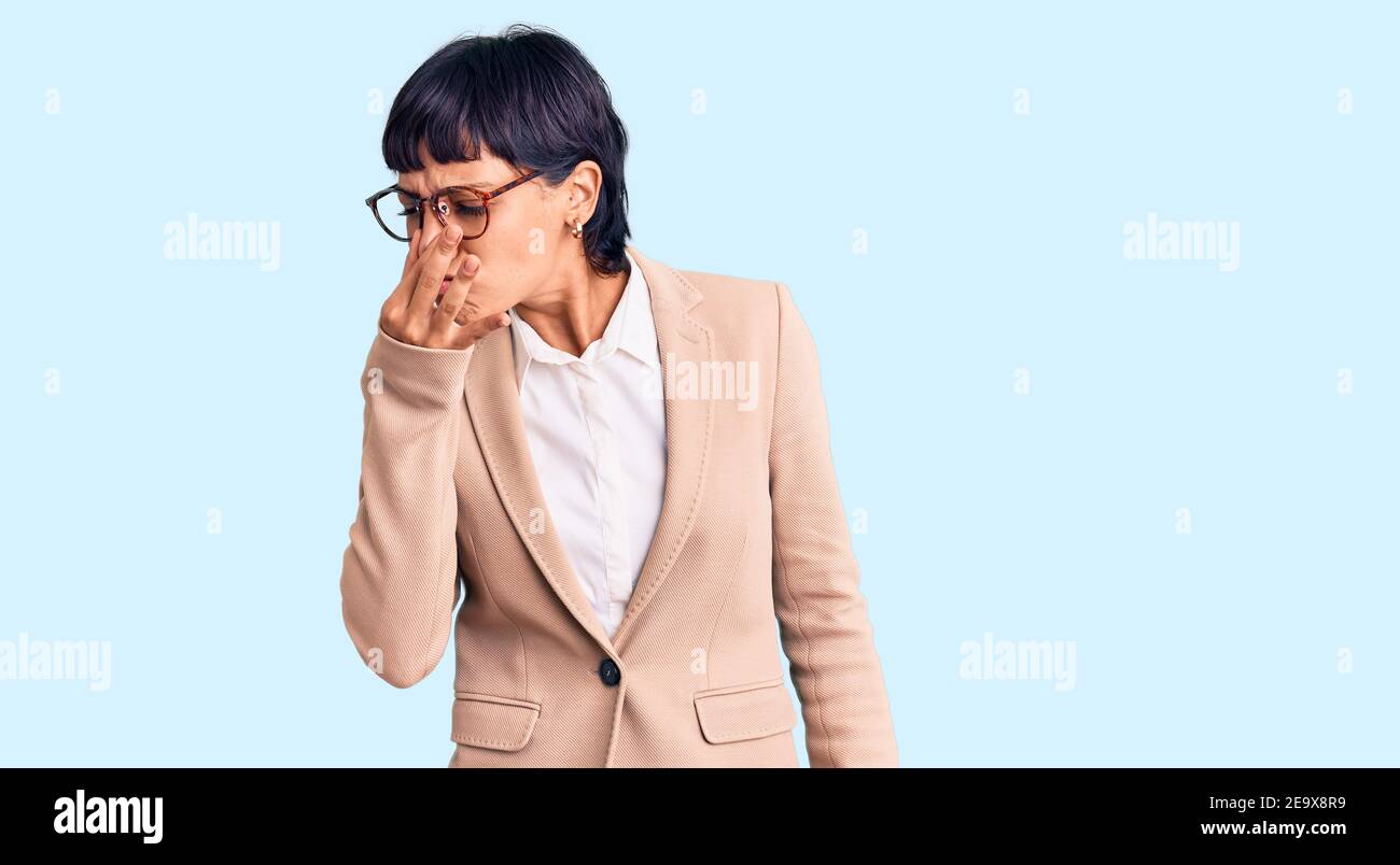 Young Brunette Woman With Short Hair Wearing Business Jacket And