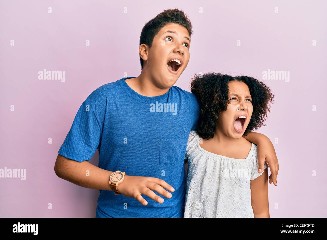 Young hispanic family of brother and sister wearing casual clothes ...