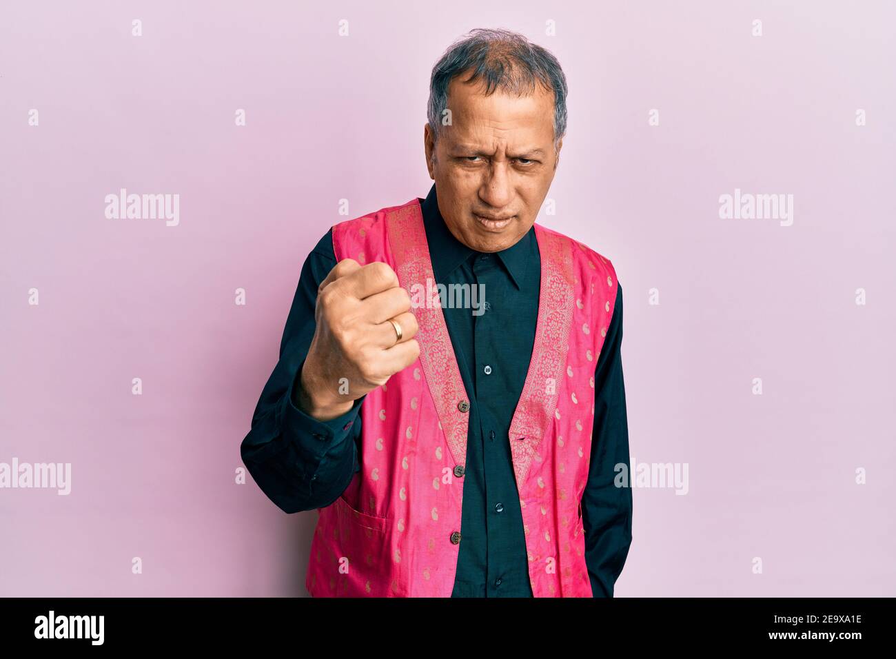 Middle age indian man wearing traditional indian clothes angry and mad ...