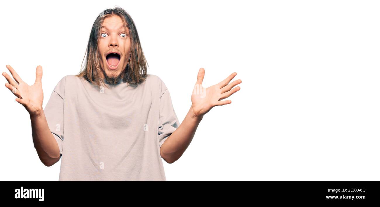 Handsome caucasian man with long hair wearing casual clothes ...