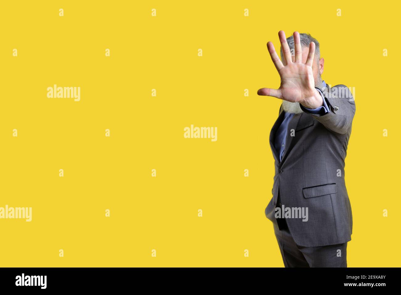 Mature businessman in gray suit shows hand stop sign, gesture no more ...