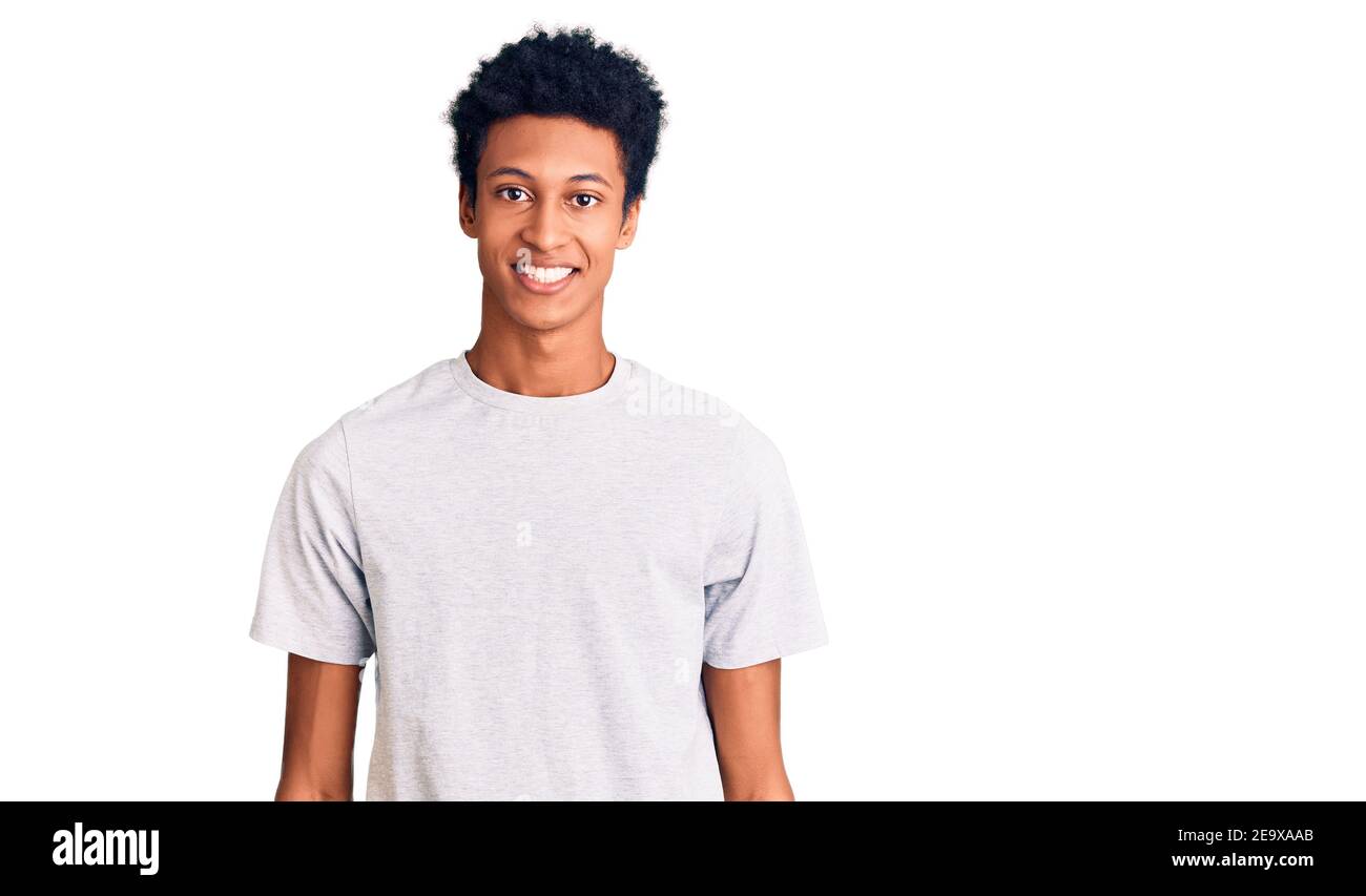 Young african american man wearing casual clothes with a happy and cool ...