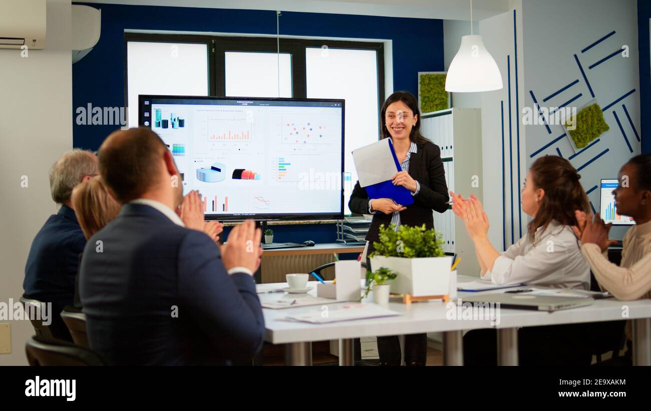 Business audience applauding woman leader manager thank for conference ...