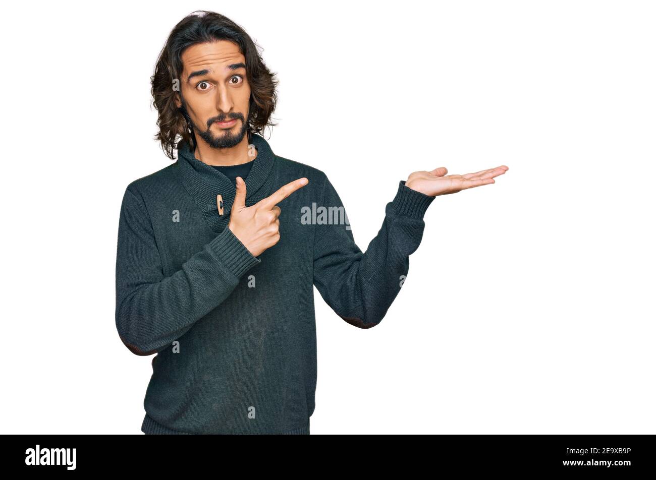 Hispanic man beard pointing palm Cut Out Stock Images & Pictures - Alamy