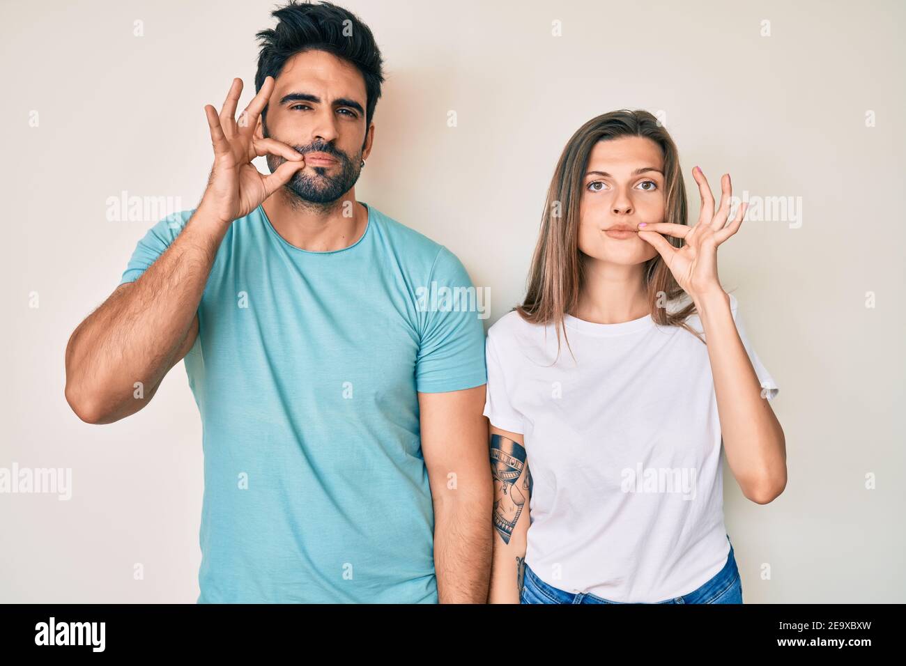 Beautiful young couple of boyfriend and girlfriend together mouth and ...