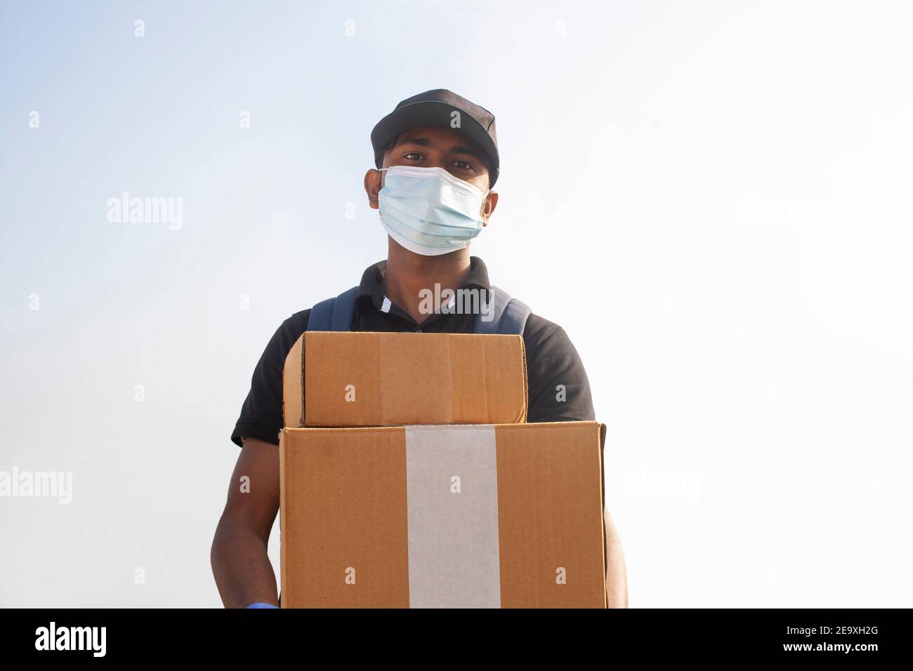 Delivery Boy Carrying Box High Resolution Stock Photography and Images ...