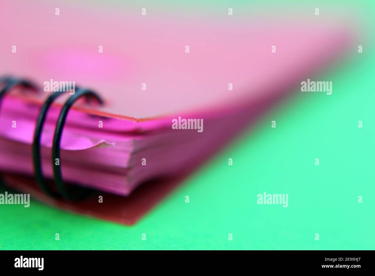 Spiral binder, pink notebook, foreground, desk background Stock Photo ...