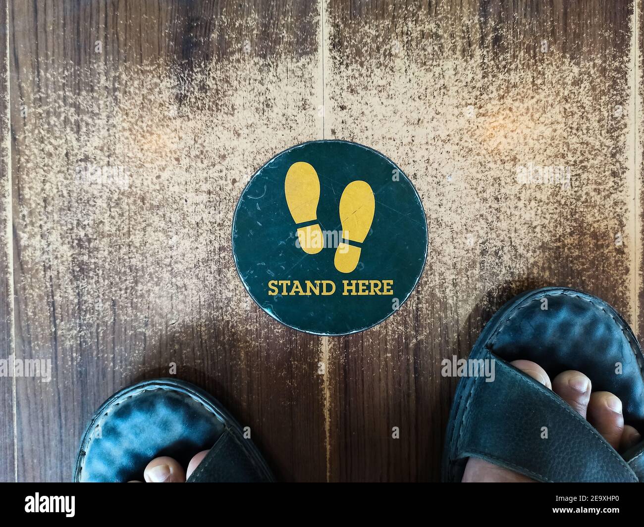 Stand here foot sign or symbol on the floor,Top view style Stock Photo ...