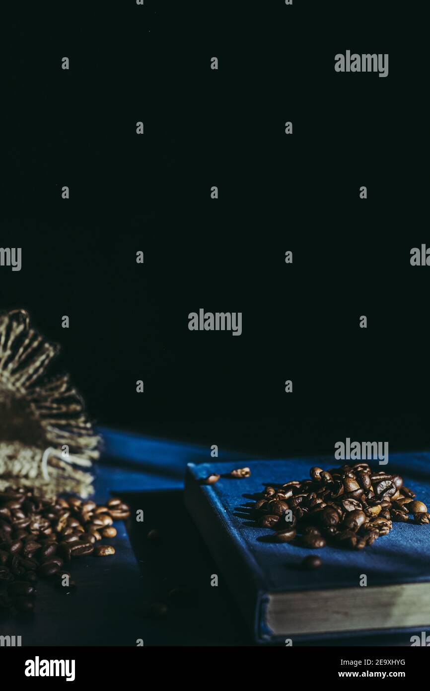 Roasted coffee beans on a navy blue background Stock Photo - Alamy