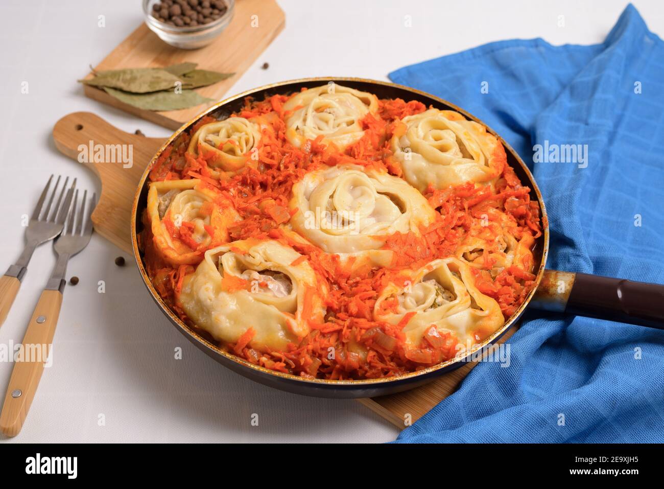 uzbek manti at home in a frying pan with stewed vegetables, ingredients ...