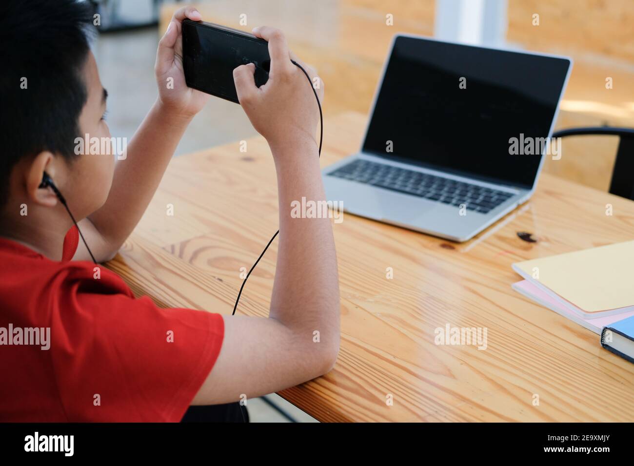asian boy kid playing video games on smartphone. children leisure Stock ...