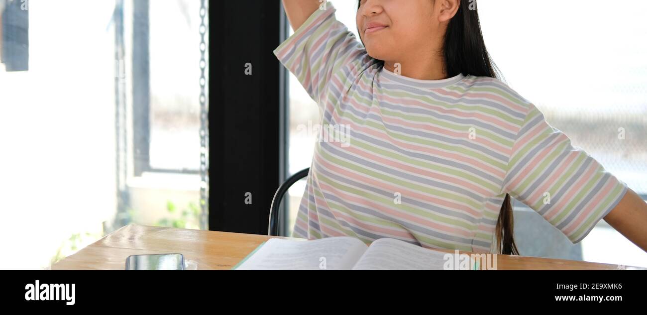 asian girl student stretching while reading book feeling tired bored ...