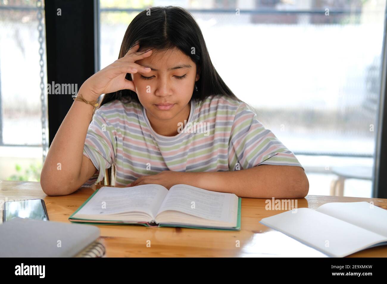 asian girl student studying hard feeling stressed tired exhausted bored ...