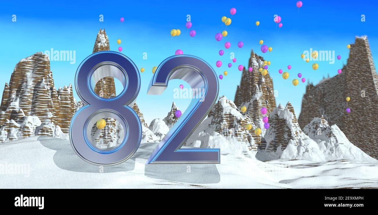 Number 82 in thick blue font on a snowy mountain with rock mountains ...