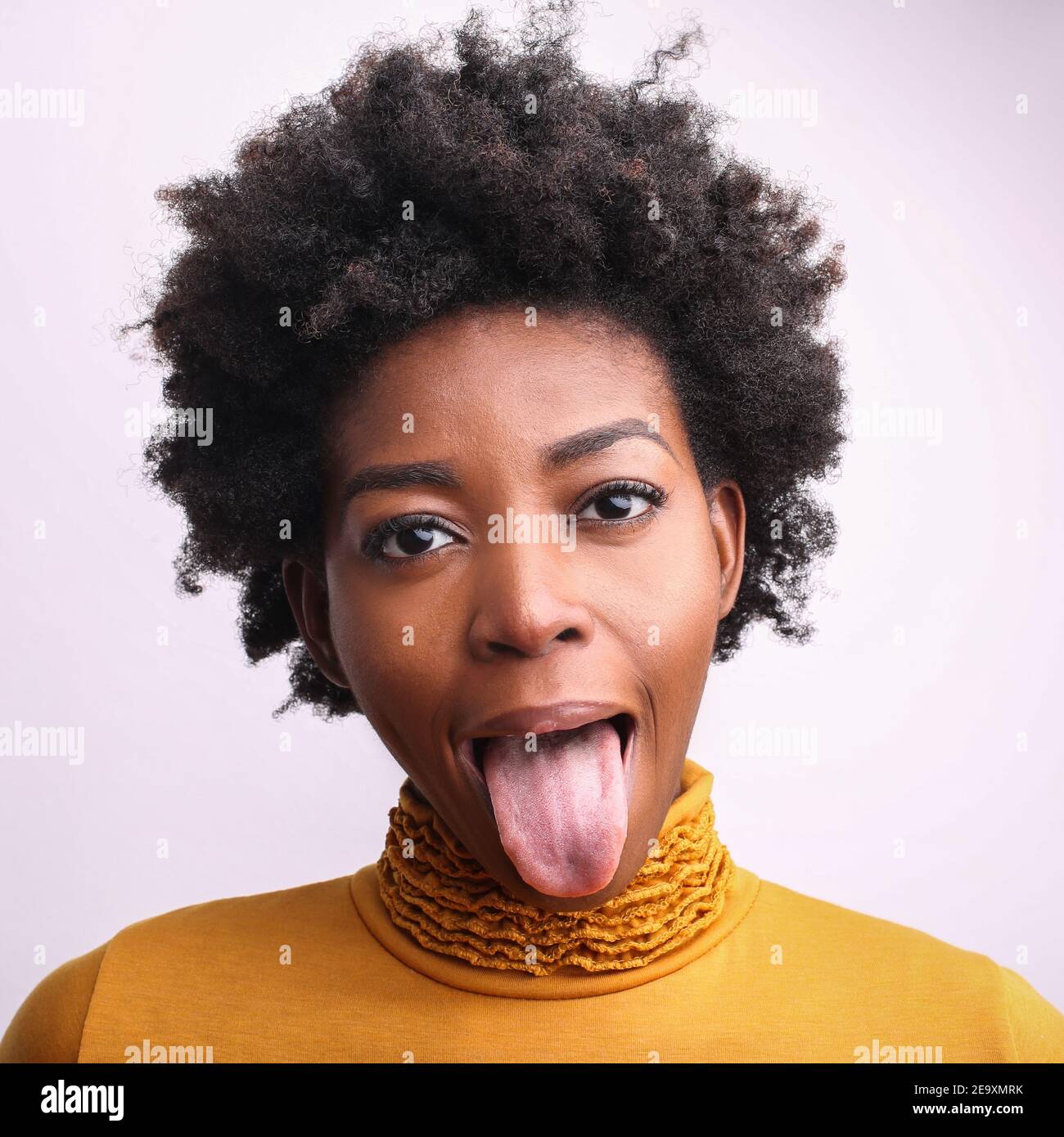 Portrait of a cool African woman with short curly hair sticking out her ...