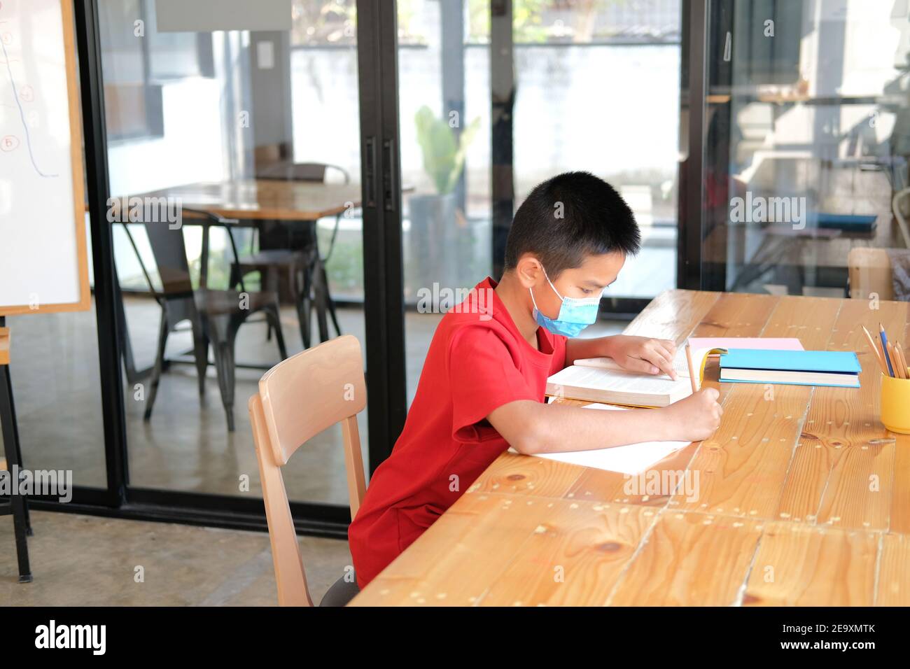 asian boy student wearing face mask studying writing notes doing ...