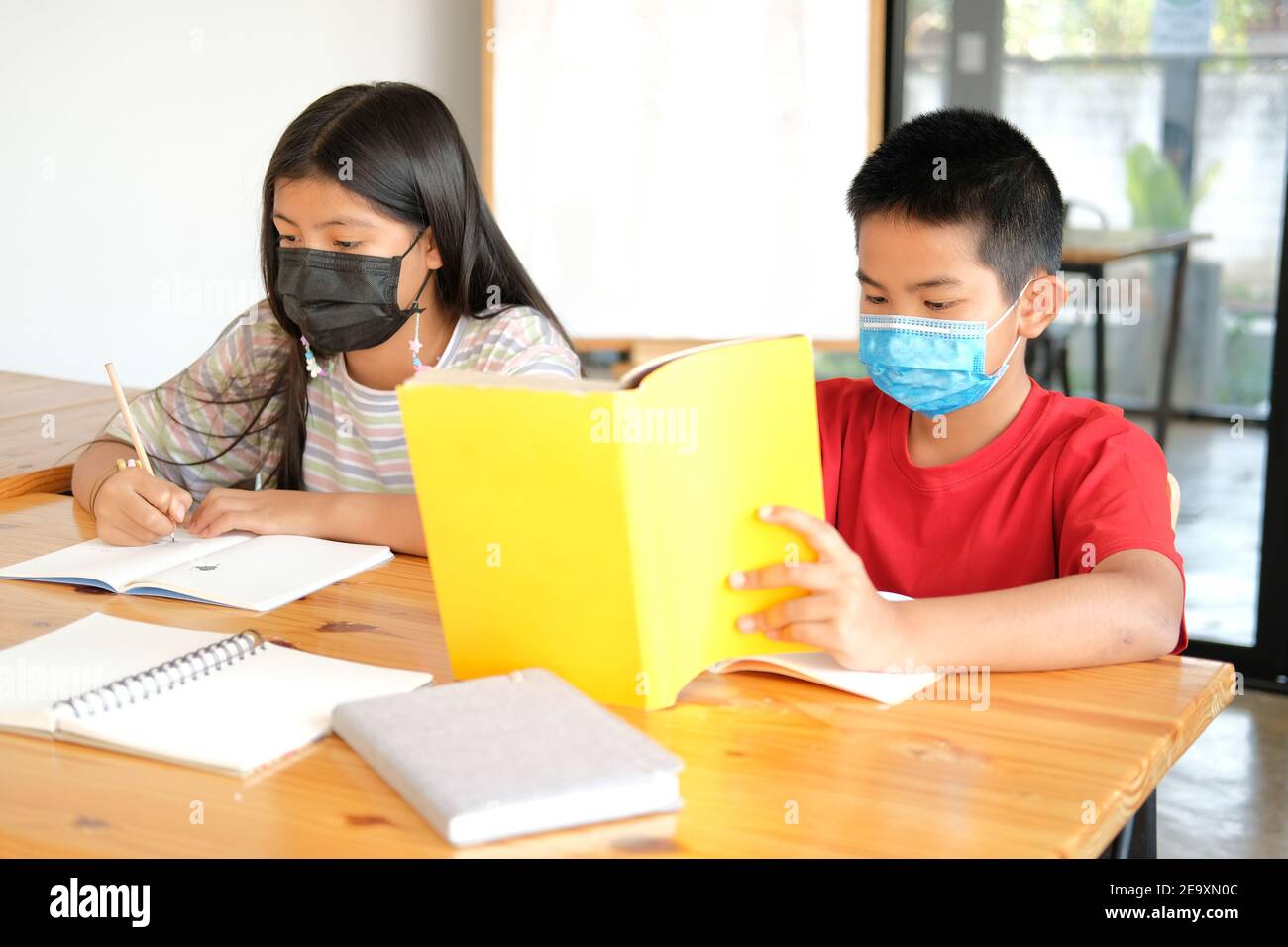 asian girl boy student wearing face mask studying writing notes doing ...