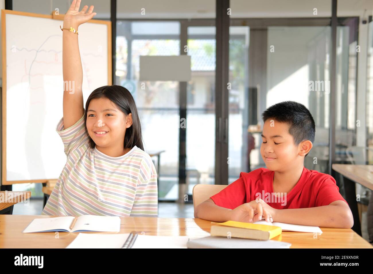 asian girl boy student studying raising hand in classroom. learning ...