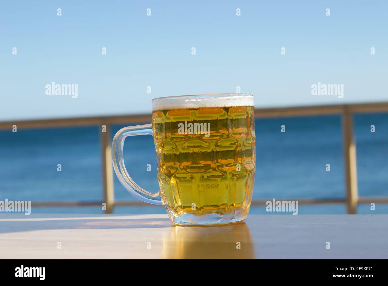 Glass of beer if front of Atlantic ocean Stock Photo - Alamy