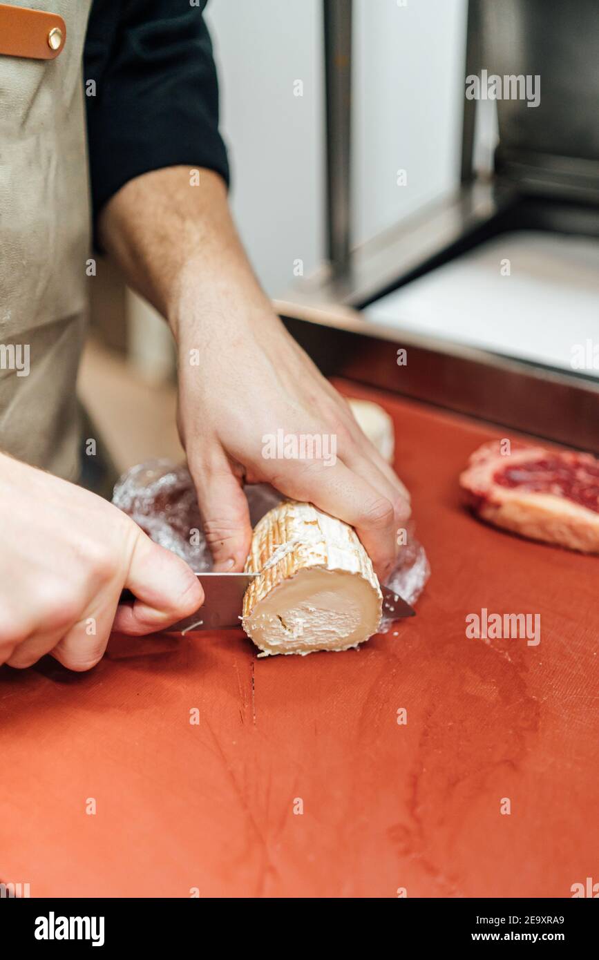 Vertical shot hand cutting hi-res stock photography and images - Alamy