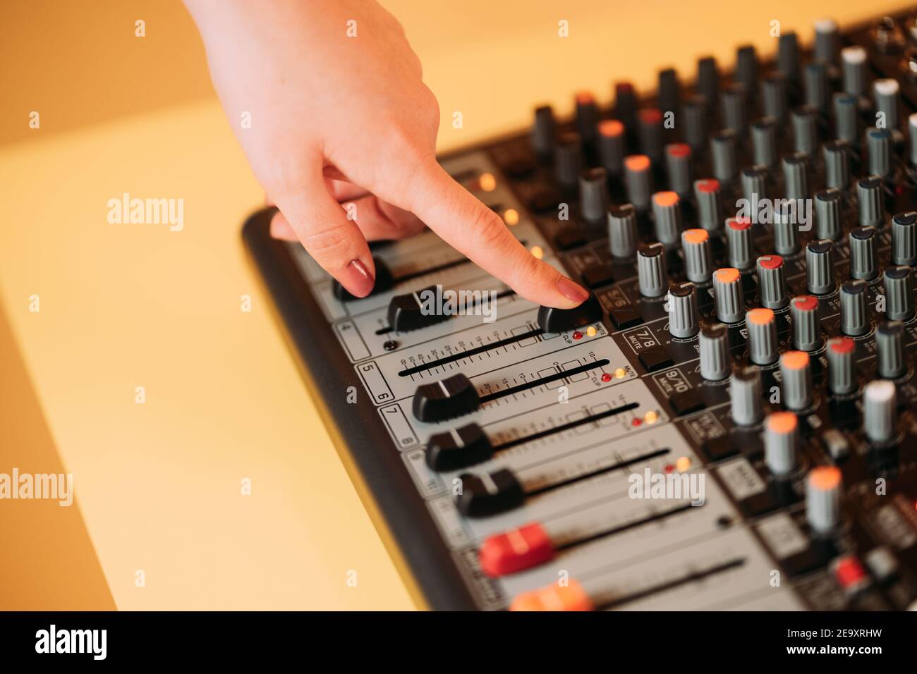 Crop hand of Woman using equalizer in music studio on blurred ...