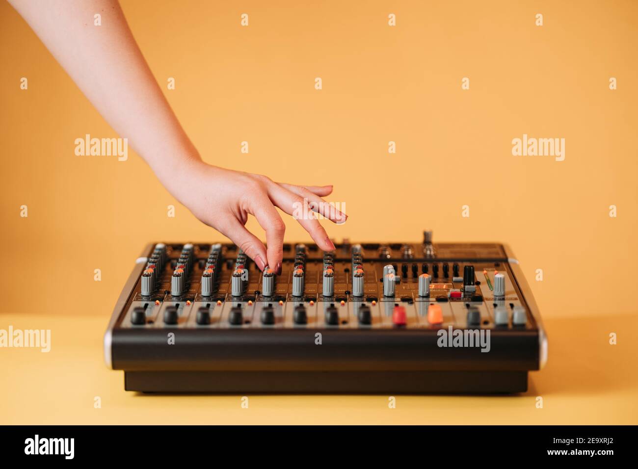 Crop hand of Woman using equalizer in music studio on blurred ...