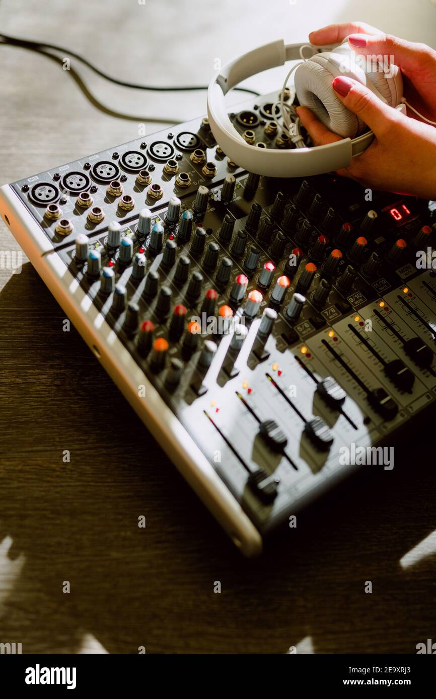 Crop hand of Woman using equalizer in music studio on blurred ...