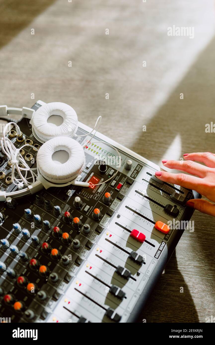 Crop hand of Woman using equalizer in music studio on blurred ...