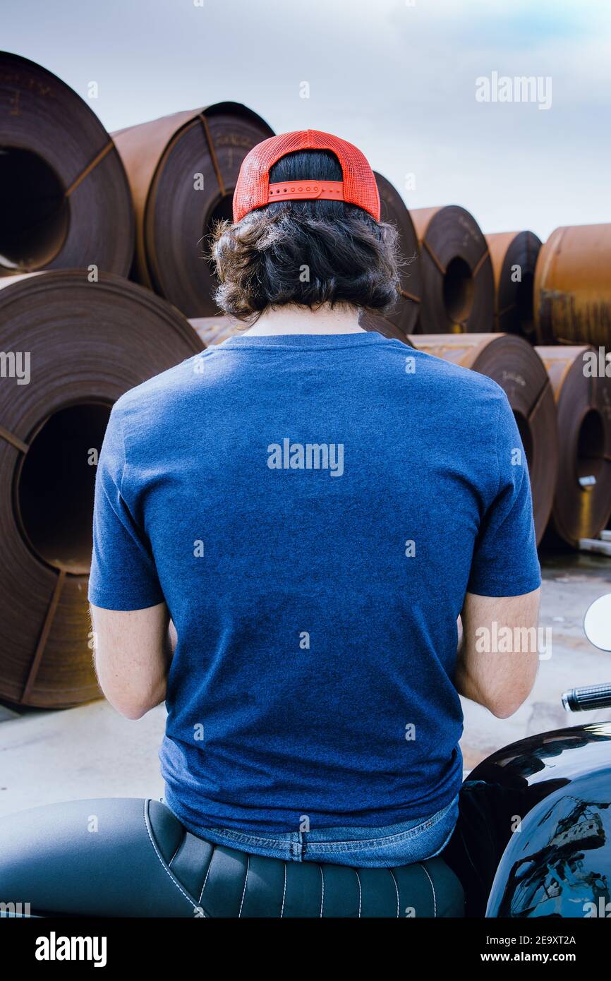 Back view of unrecognizable male with dark hair in casual outfit and ...