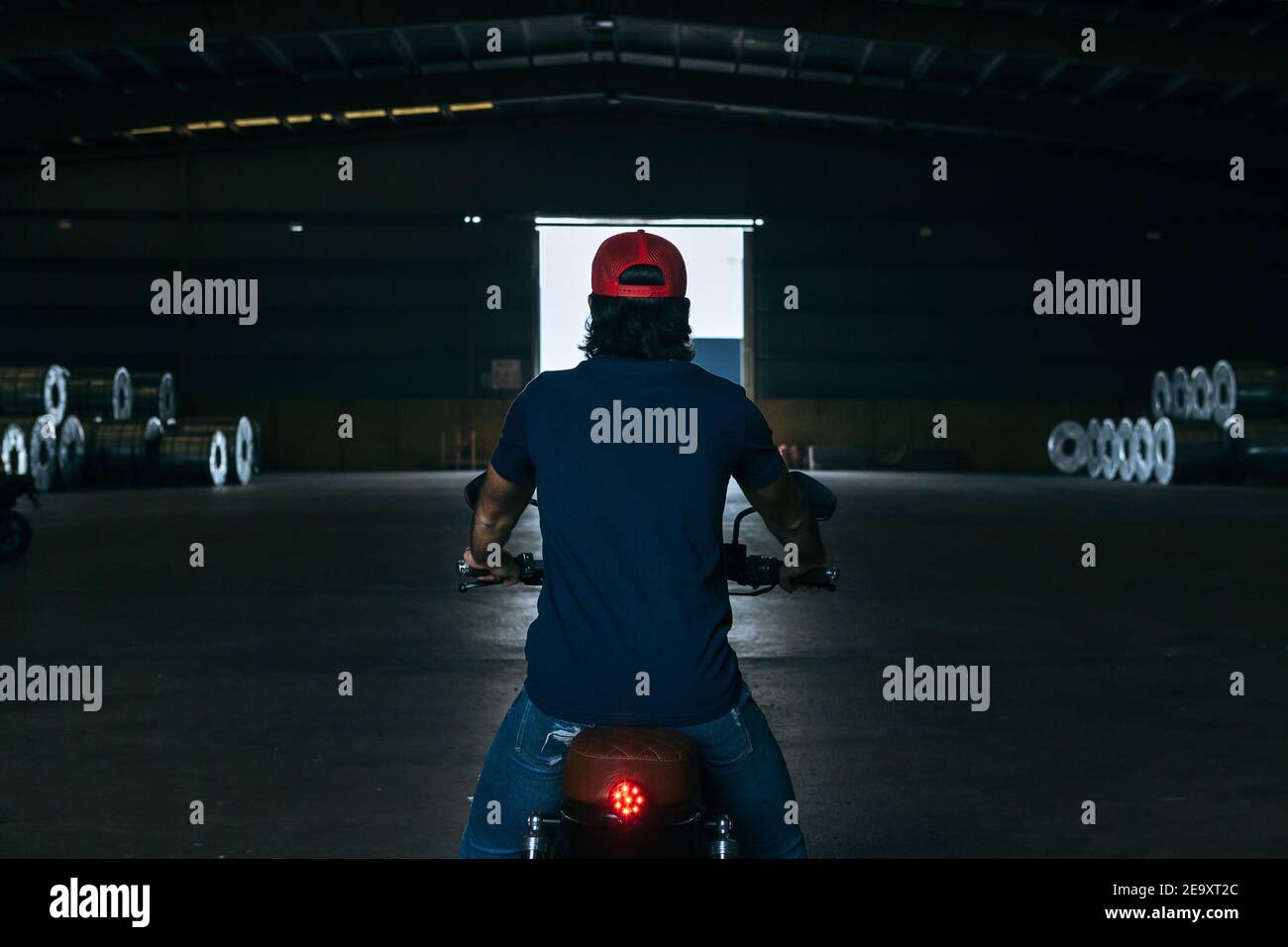 Crop anonymous male barista turning on professional coffee machine for ...